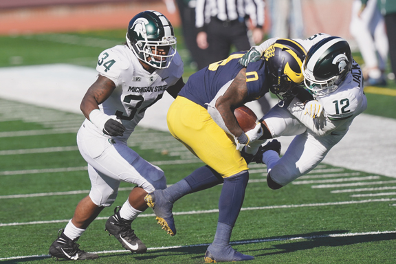 Punches fly at end of Michigan Wolverines’ 24-17 football win over ...